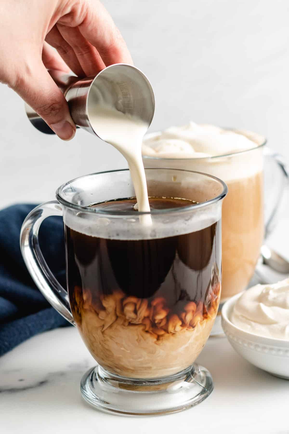 Pouring Cream Into Coffee